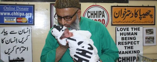 Social Worker Ramzan Chhipa holds an unwanted child with profound ...